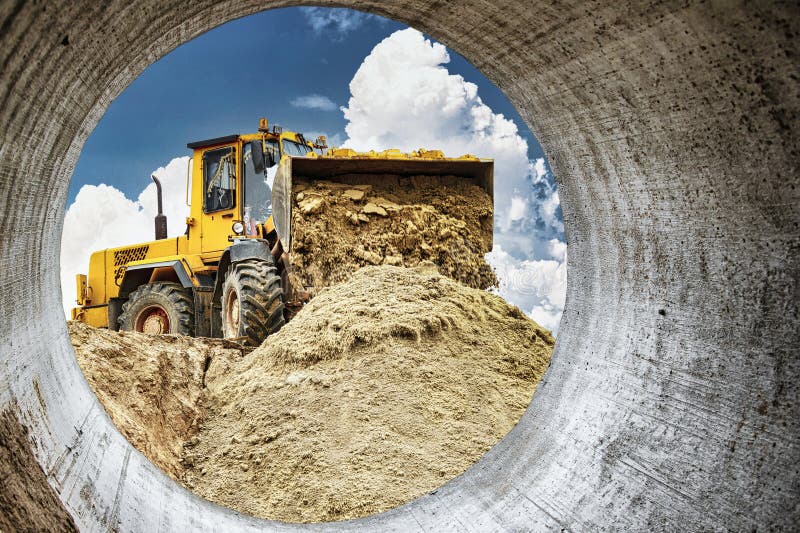 Powerful Wheel Loader or Bulldozer Working on a Quarry or Construction ...