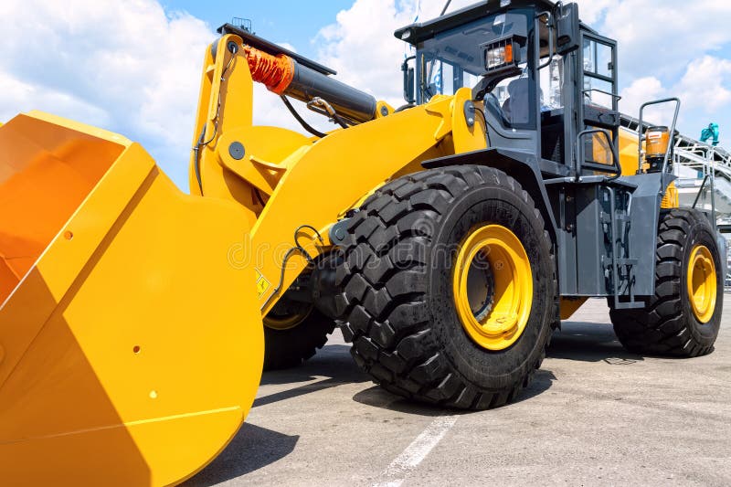 Powerful Yellow New Front Loader Stock Photo - Image of loader, yellow ...
