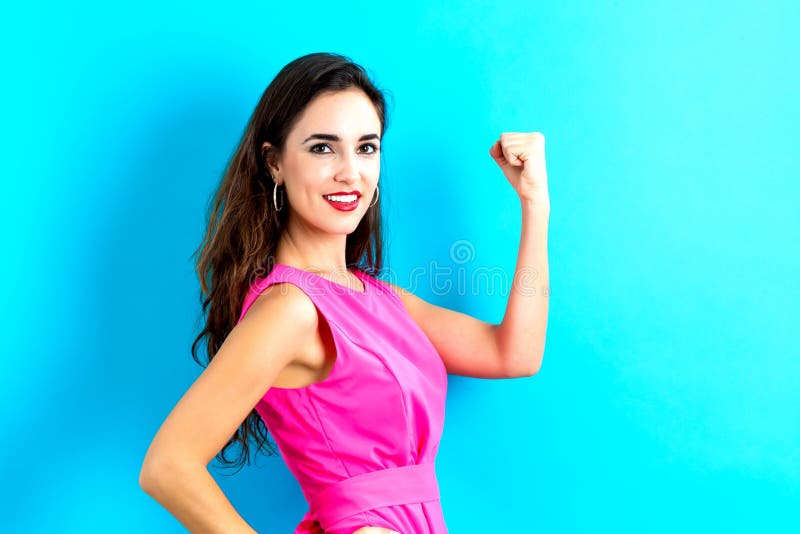 Powerful young woman stock photo. Image of flexing, people - 96761594