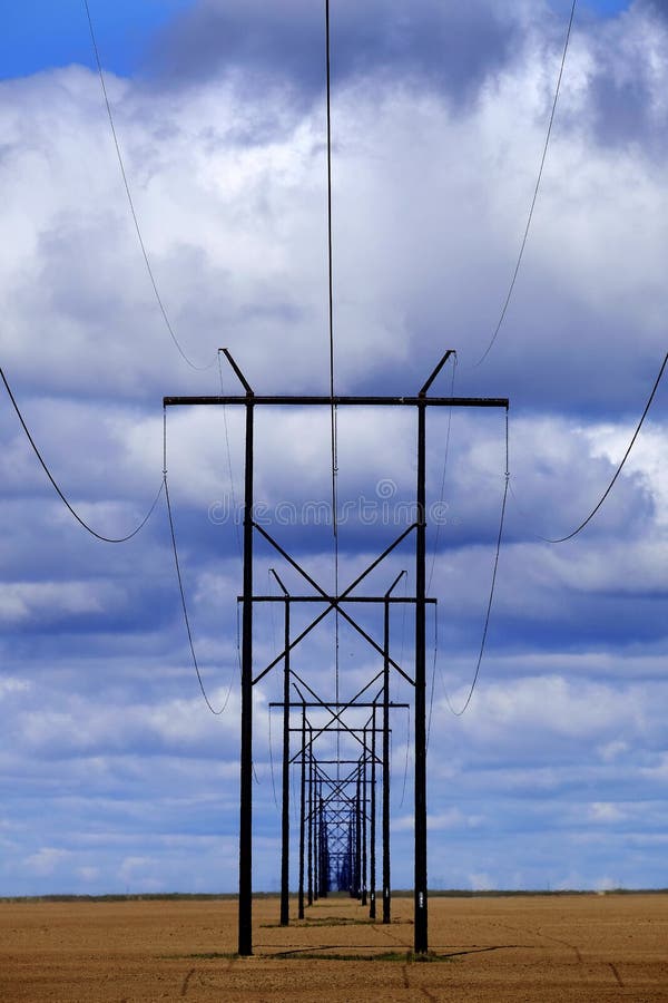 Powerlines in Field with Blue Sky and Clouds Stock Image - Image of ...