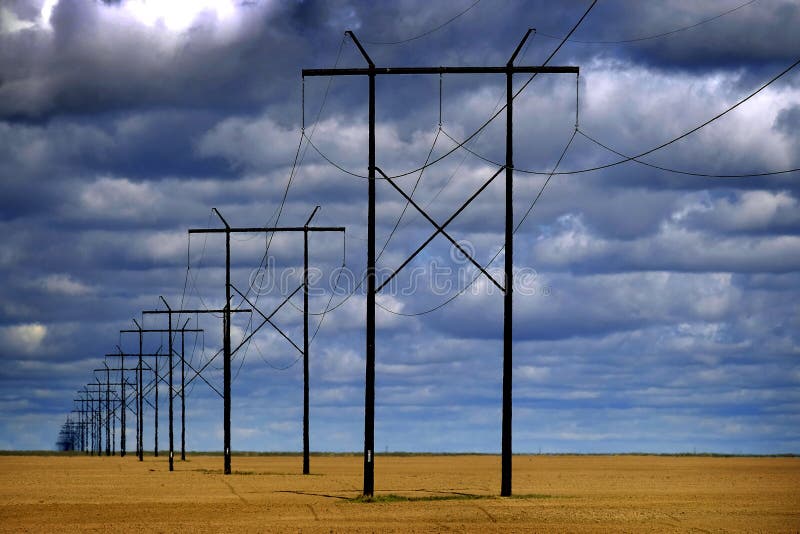Powerlines in Field with Blue Sky and Clouds Stock Photo - Image of ...