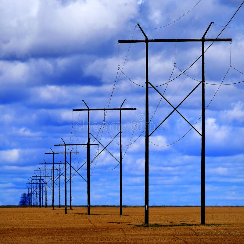 Powerlines in Field with Blue Sky and Clouds Stock Photo - Image of ...