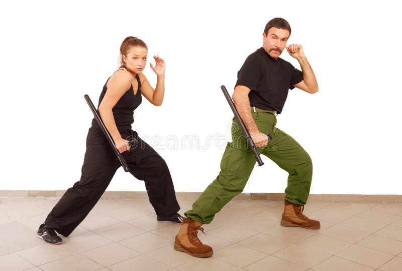 Practce Del Hombre Y De La Mujer Con La Matraca Foto de archivo ...