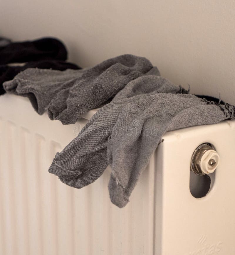 Practical Laundry Drying at Home in Winter, Socks Drying on Heating ...