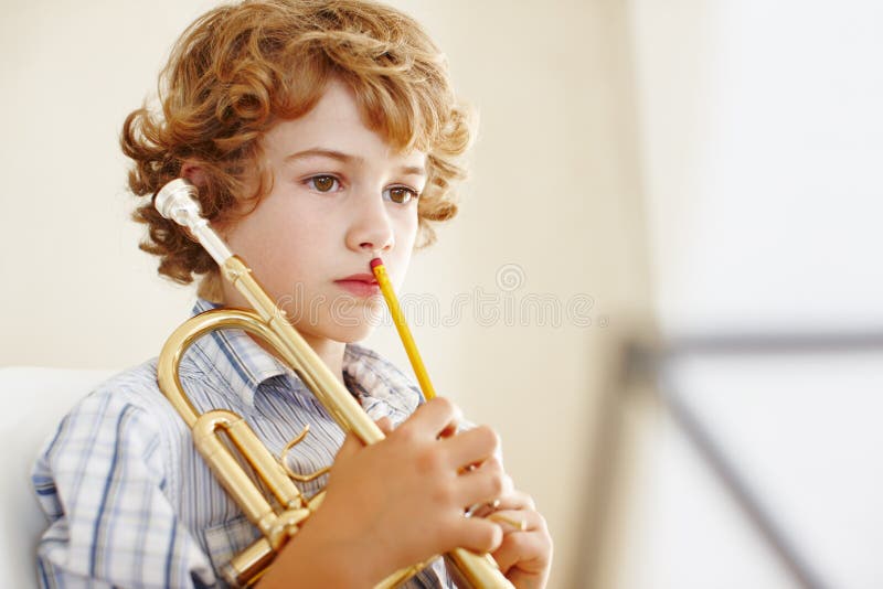 Practice Keeps Him Disciplined. a Cute Little Boy Playing the Trumpet ...