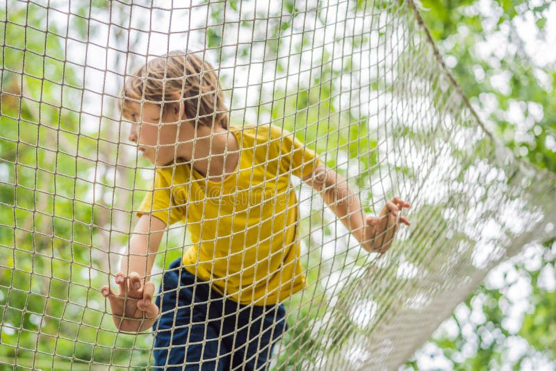 Practice Nets Playground. Boy Plays in the Playground Shielded with a ...