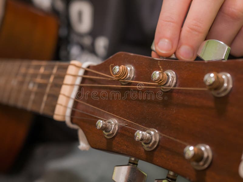 Practice Playing the Acoustic Guitar. Hands Playing Guitar and Picking ...