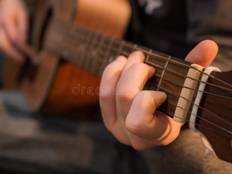 Practice Playing the Acoustic Guitar. Hands Playing Guitar and Picking ...