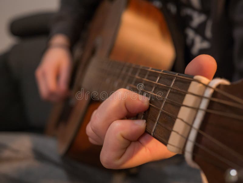 Practice Playing the Acoustic Guitar. Hands Playing Guitar and Picking ...