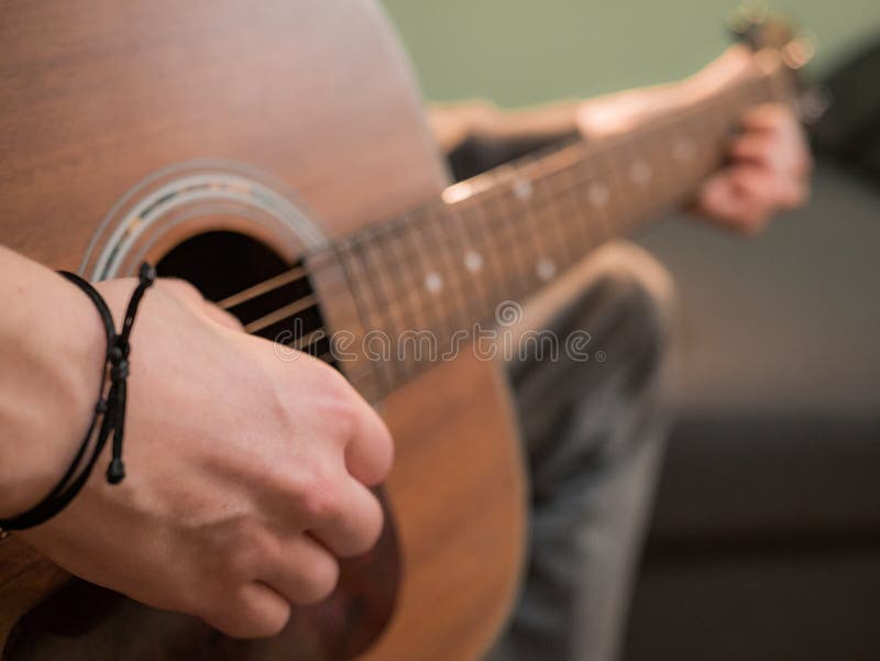 Practice Playing the Acoustic Guitar. Hands Playing Guitar and Picking ...