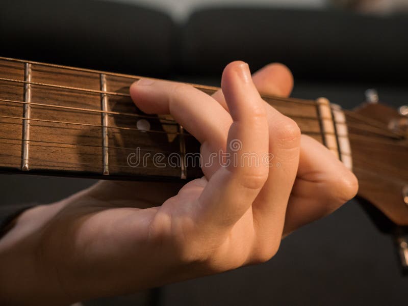 Practice Playing the Acoustic Guitar. Hands Playing Guitar and Picking ...