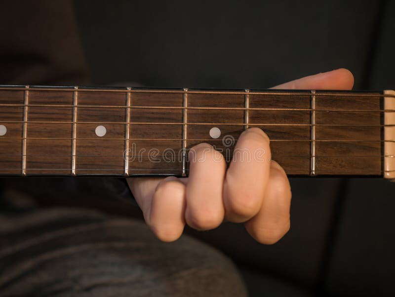 Practice Playing the Acoustic Guitar. Hands Playing Guitar and Picking ...