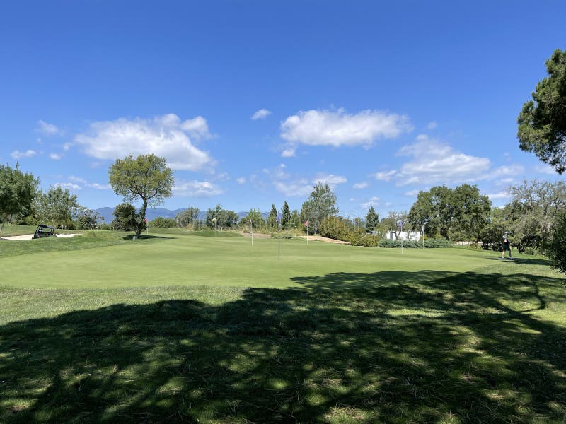 Practice Putting Green at a Golf Course Stock Photo - Image of pond ...