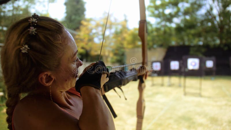 Practice and Training of Archery in Shooting Range. Sport Woman in ...