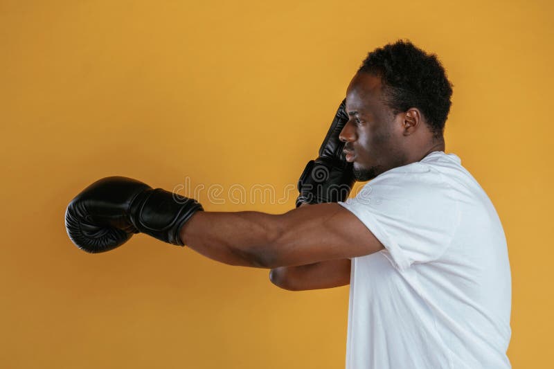 Practicing Boxing Punch Black Guy Against Yellow Background Stock ...