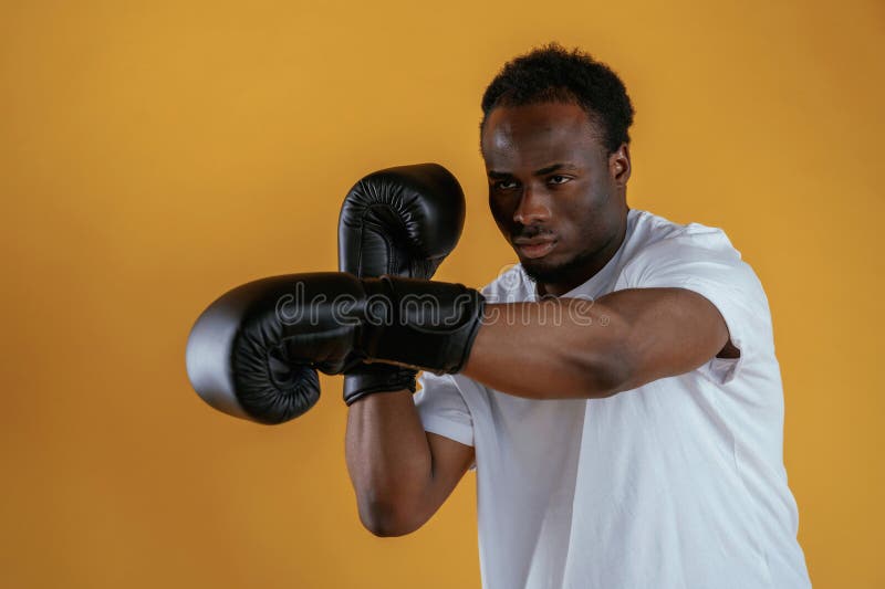 Practicing Boxing Punch Black Guy Against Yellow Background Stock ...
