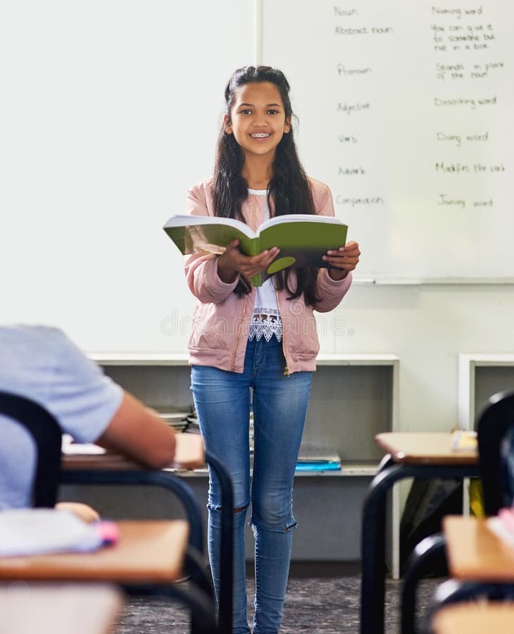 Practicing Her Presentation Skills. a Young Schoolgirl Giving a ...