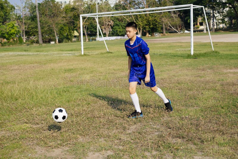 Practicing of Little Football Player Stock Image - Image of grass ...
