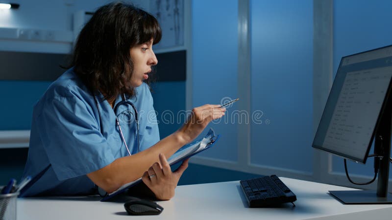 Practitioner Assistant with Blue Uniform and Stethoscope Analyzing ...