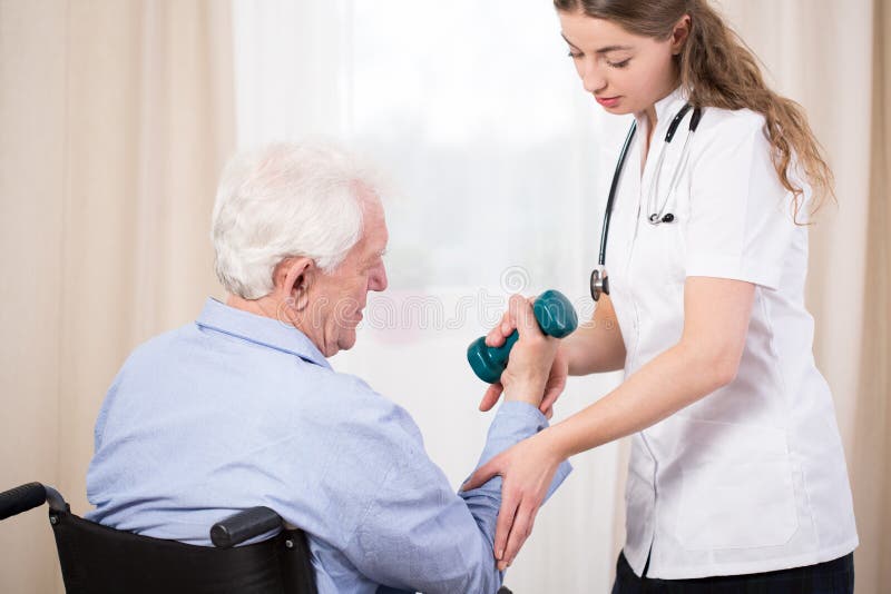 Practitioner Showing Patient Exercise Stock Photo - Image of medic ...