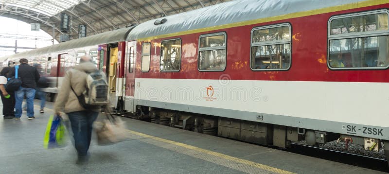 People Boarding a Long Red Train at the Prague Main Train Station ...