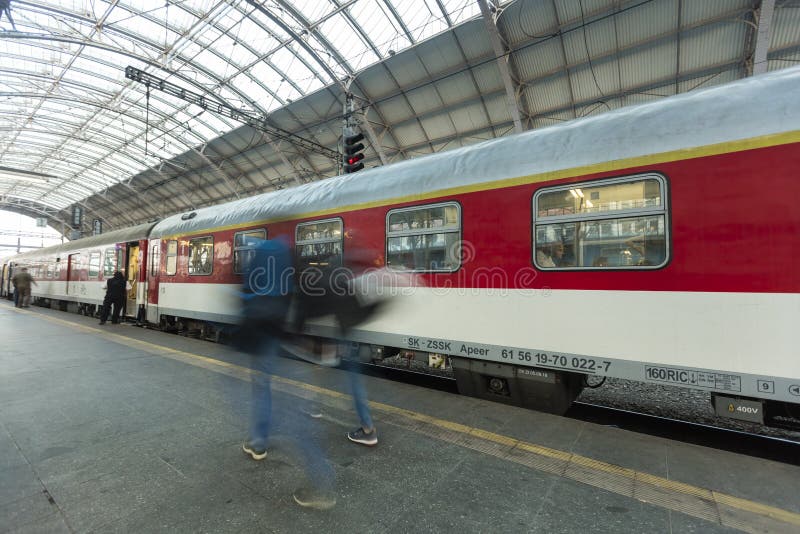 People Boarding a Long Red Train at the Prague Main Train Station ...