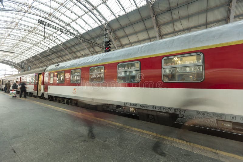 People Boarding a Long Red Train at the Prague Main Train Station ...