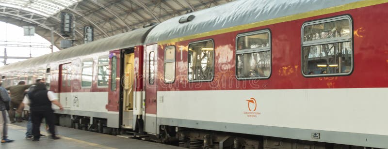 People Boarding a Long Red Train at the Prague Main Train Station ...