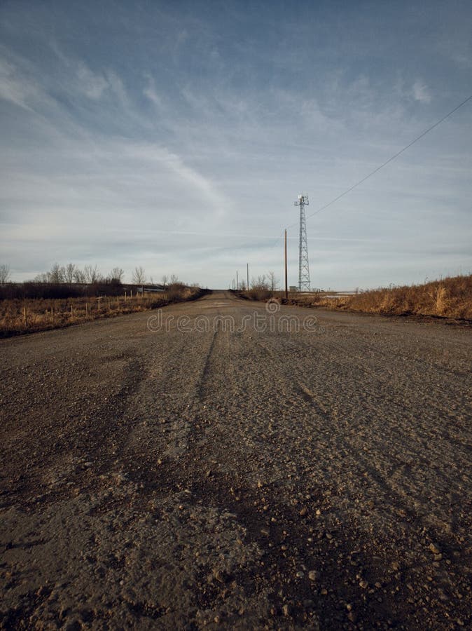 Prairie Road with Beautiful Sky Stock Photo - Image of field, wind ...