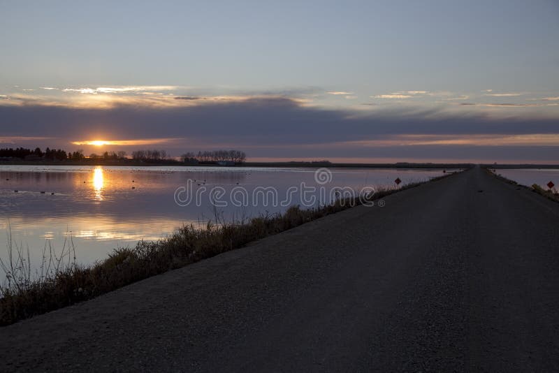 Prairie Sunset Lake and Road Stock Photo - Image of rural, road: 85581342