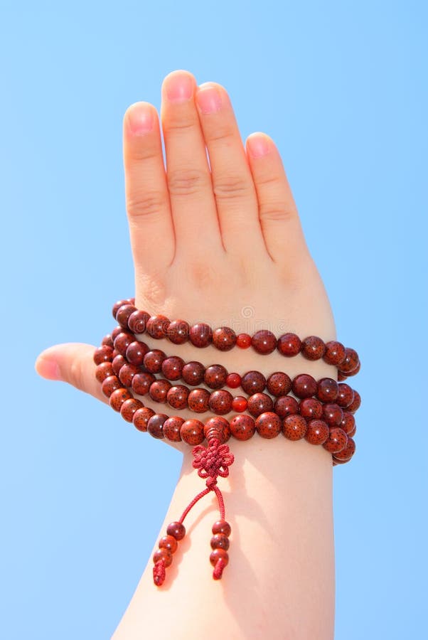 Prayer beads in her hands stock photo. Image of bead - 14066064