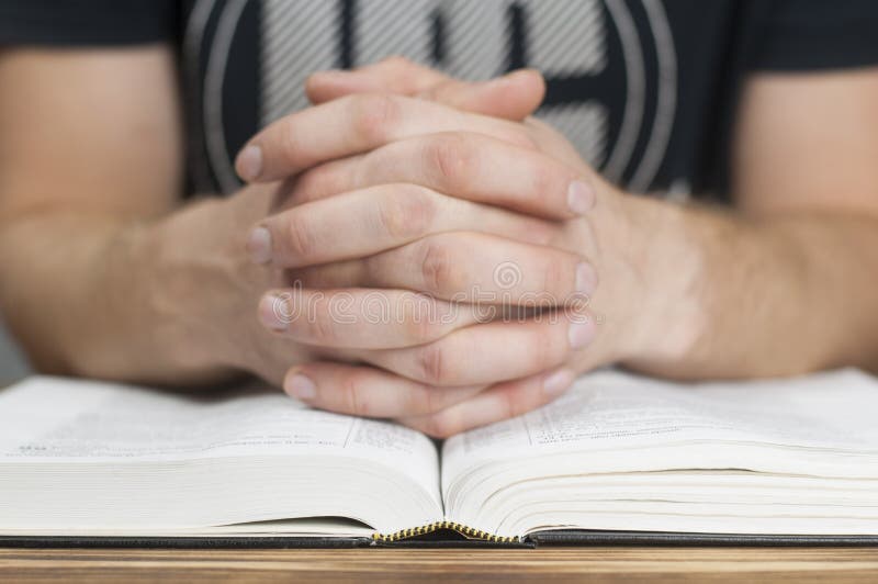 Prayer. Hands on an Open Bible in Prayer. Repentance Stock Photo ...