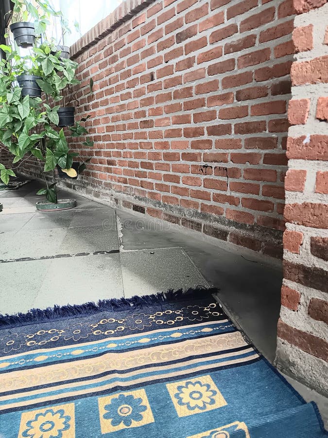 Prayer Rug Near the Brick Wall in the Prayer Room Stock Photo - Image ...