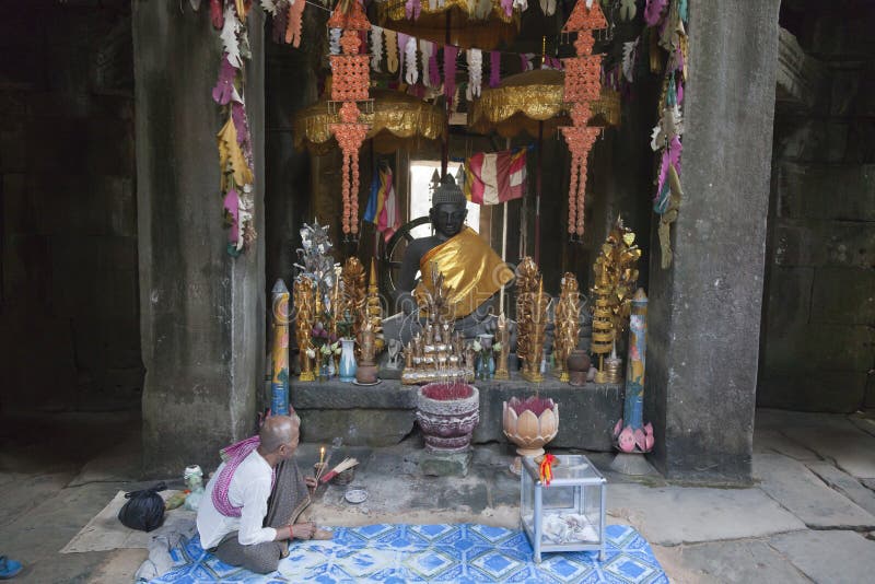 Prayer at Ruins of Angkor Wat in Cambodia Editorial Image - Image of ...