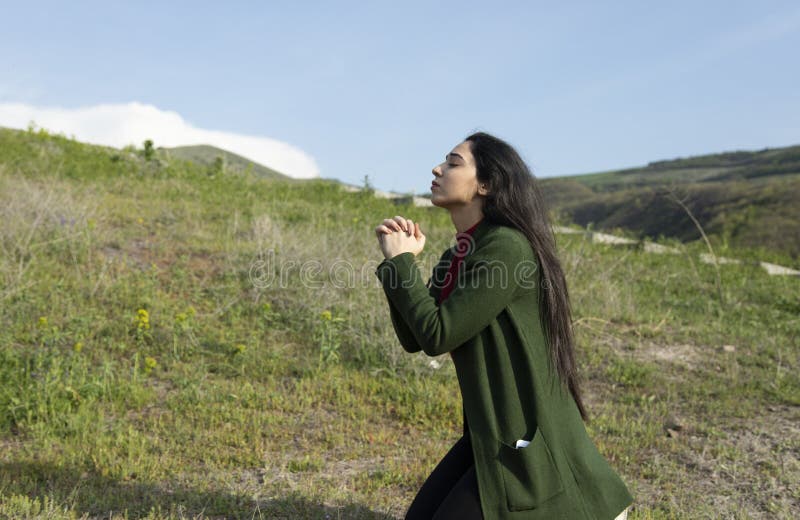 Prayer woman in nature stock image. Image of nature - 189089999