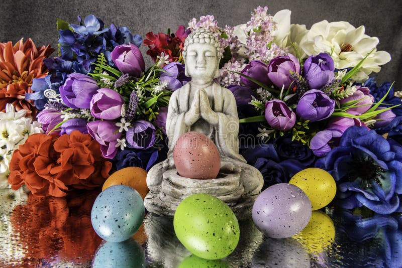 Praying Buddha Statue with Colored Easter Eggs and Spring Flowers Stock ...