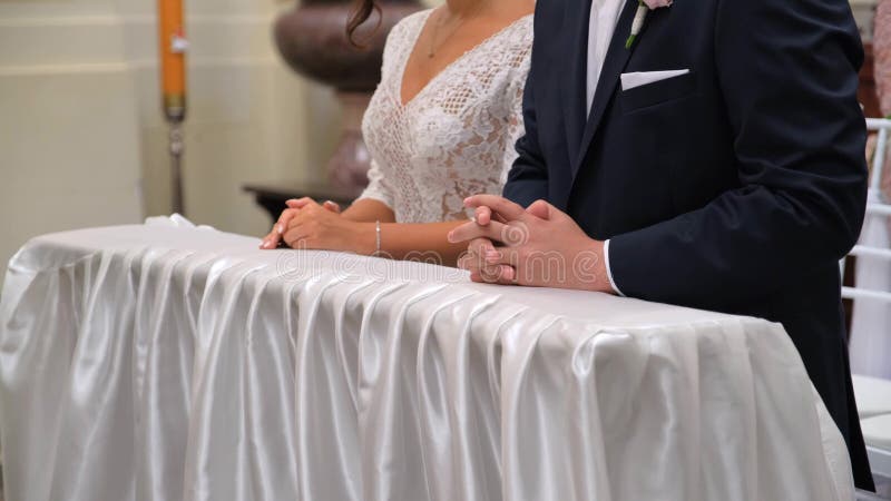 Praying in the Catholic Church. Stock Video - Video of stoop, groom ...