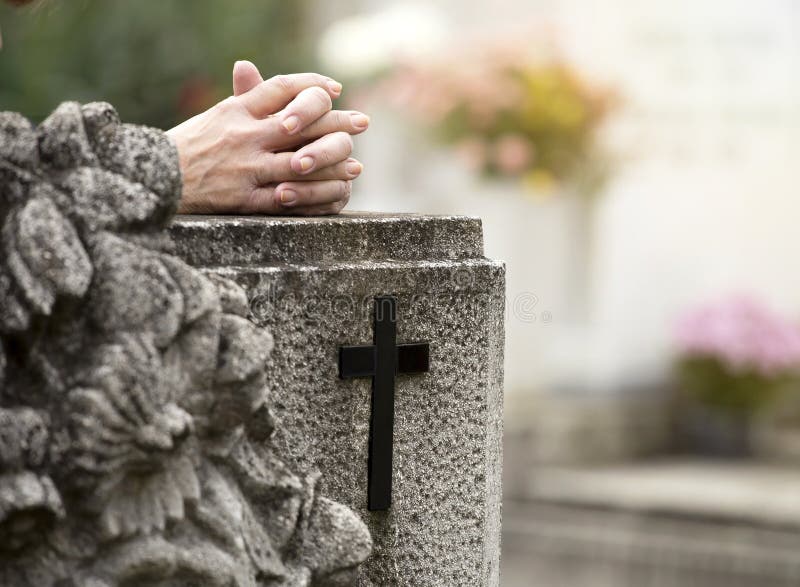 Praying in cemetery stock photo. Image of death, remembrance - 81726098