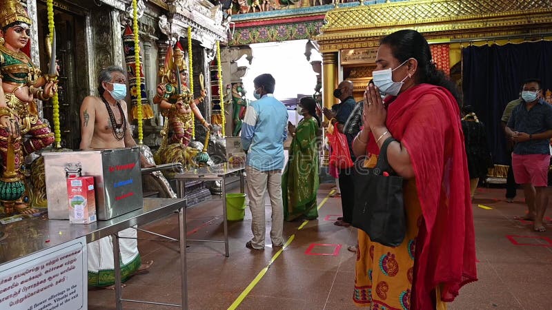 Praying in a Hindu temple. stock video. Video of belief - 233229075