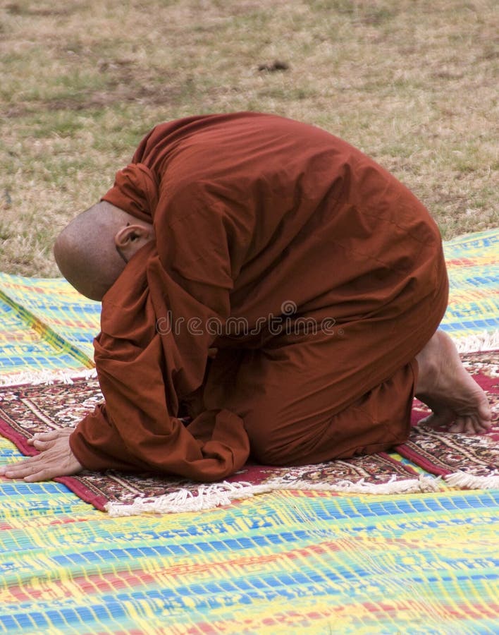 Praying Monk stock image. Image of robe, ground, barefoot - 962147
