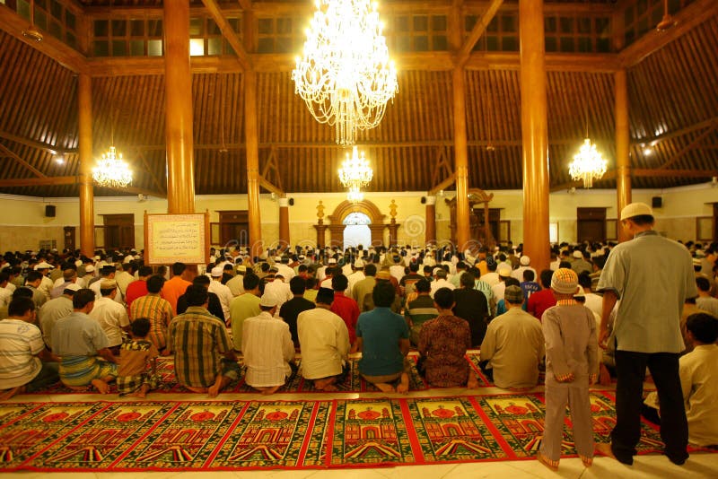 Praying in the mosque editorial image. Image of city - 41996400