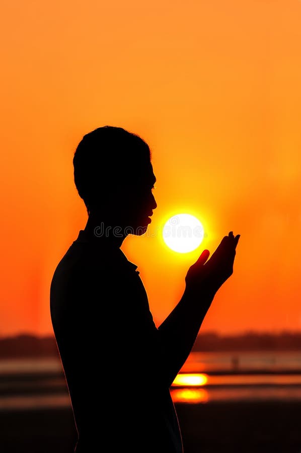 Praying at sunset stock photo. Image of morning, honest - 38125110