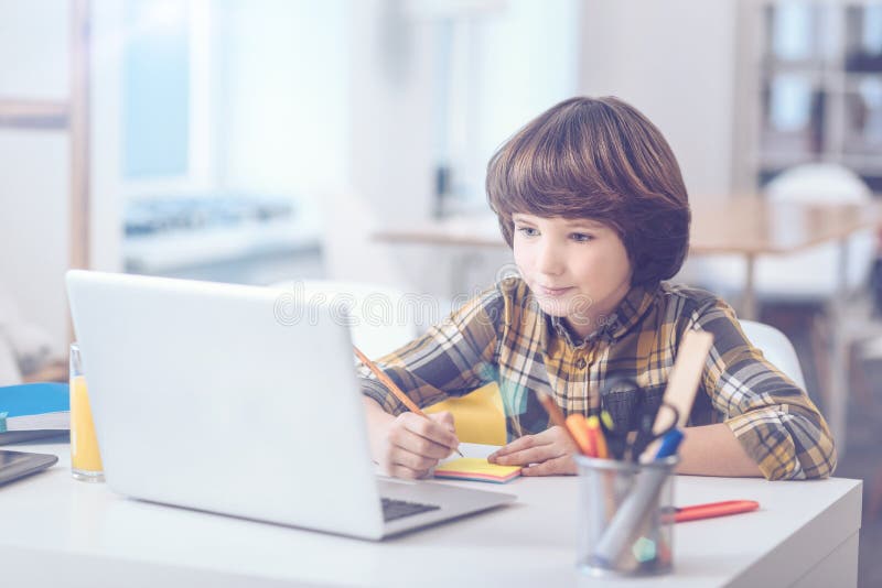 Pre-adolescent Boy Taking Notes while Studying Stock Image - Image of ...
