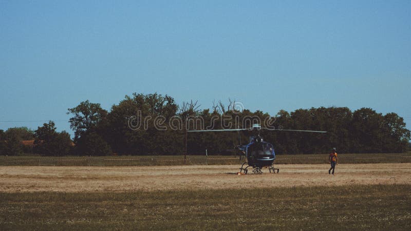 Pre-Flight Precision: Helicopter Prepares for Takeoff with Marshalling ...