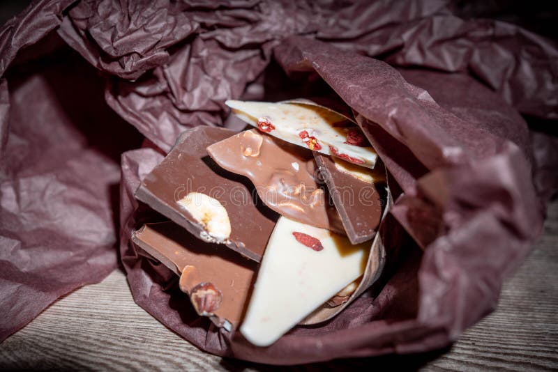 Precious Chocolate in Paper Stock Photo - Image of cacao, group: 147569096
