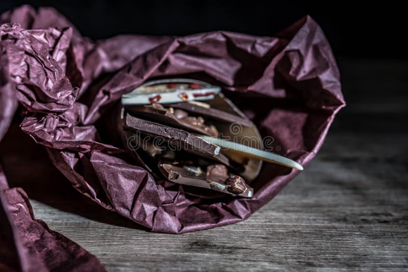 Precious Chocolate in Paper Stock Photo - Image of nuts, almond: 147569104
