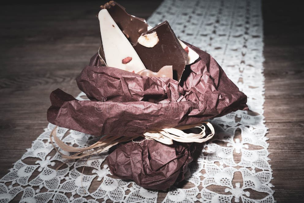 Precious Chocolate in Paper Stock Photo - Image of ingredient, almond ...