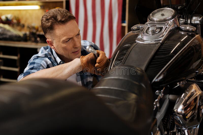 Precise Good Mechanic Fixing the Bolt Stock Photo - Image of masculine ...