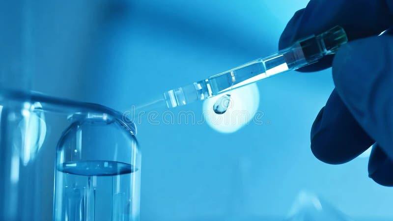Precise Liquid Transfer by Scientist in Laboratory Stock Footage ...