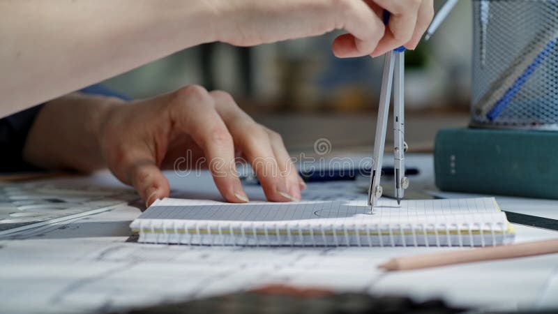 Precision Drawing with Compass on Notepad for Accurate Design Stock ...